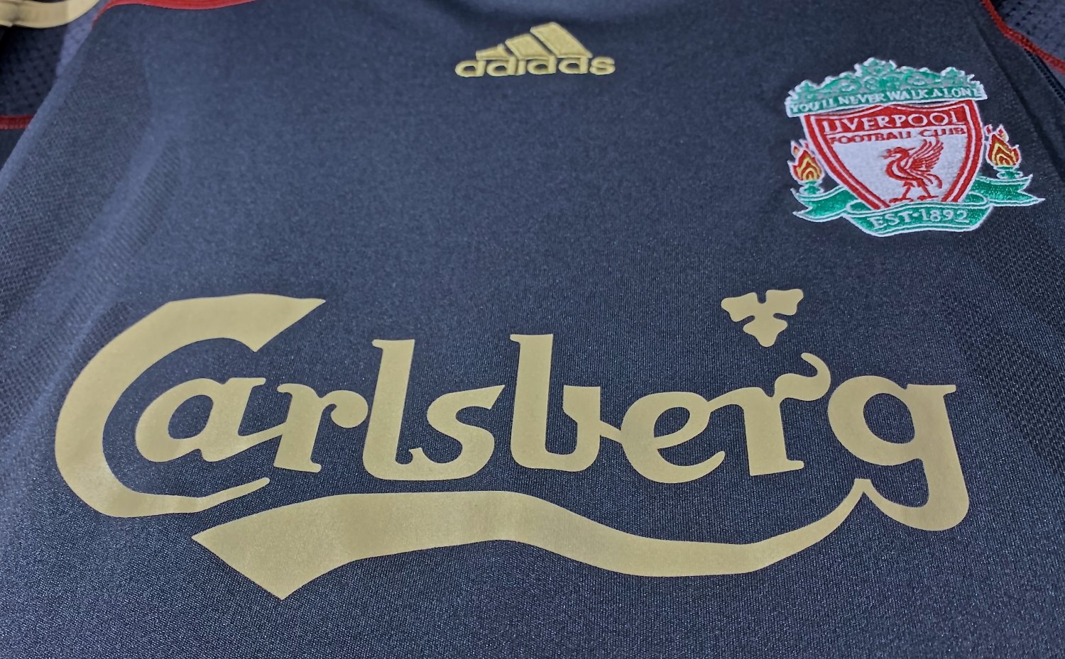 Liverpool Away football shirt 2009 - 2010. Sponsored by Carlsberg
