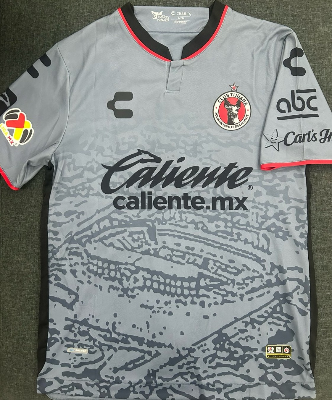 Club Tijuana Away football shirt 2023 - 2024. Sponsored by Caliente