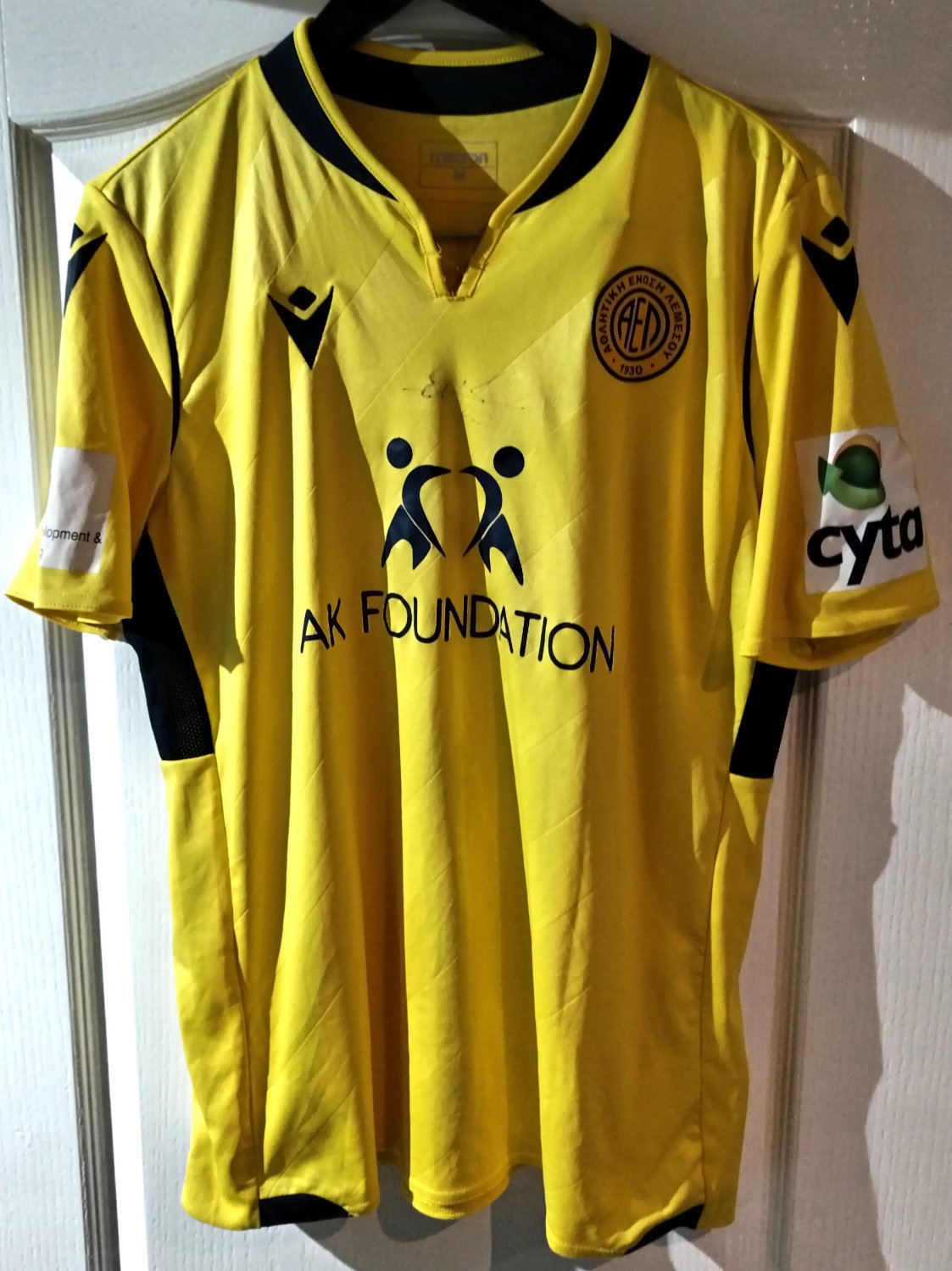 AEL Limassol Home football shirt 2022 - 2023. Sponsored by AK Foundation