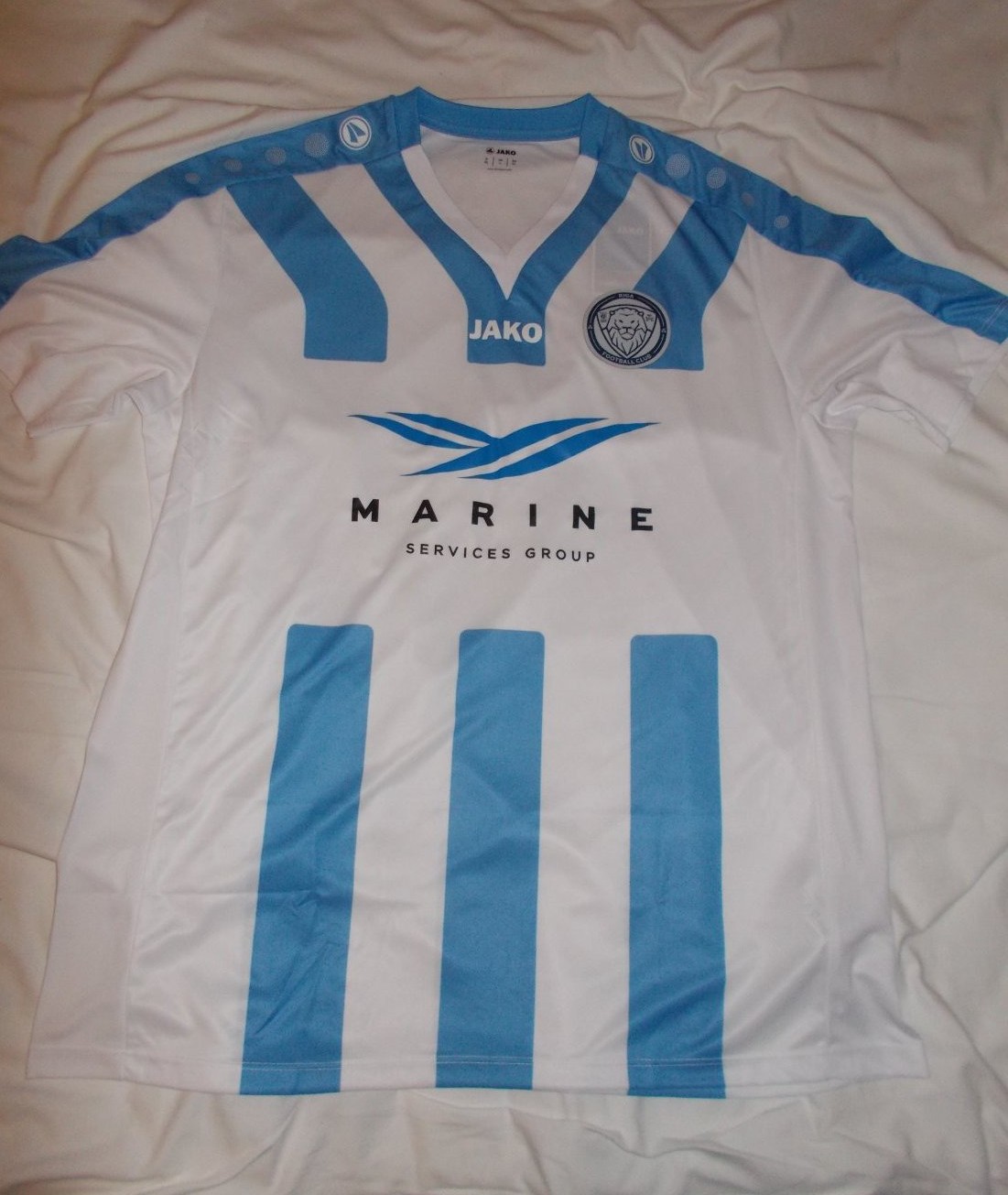 Riga FC Home football shirt 2018. Sponsored by Marine Services Group